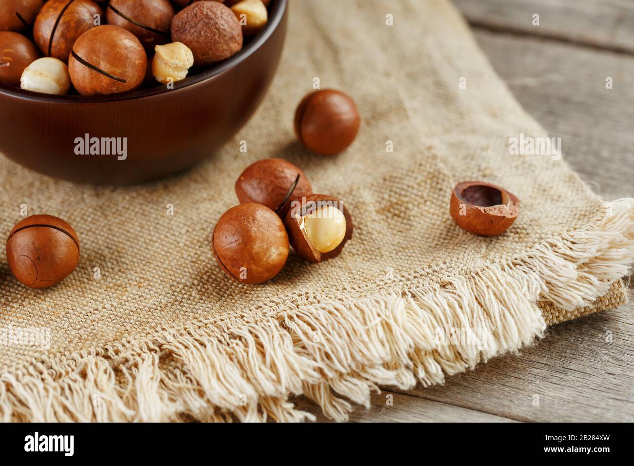 Macadamia nut on wooden background with vintage cloth, concept of ...