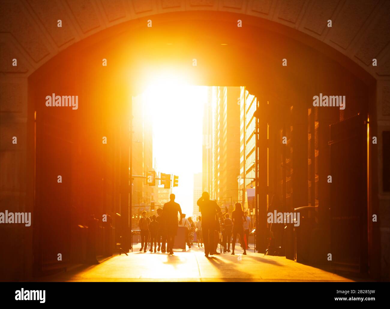 Sunset view of the crowd exiting Philadelphia city hall over orange lit ...