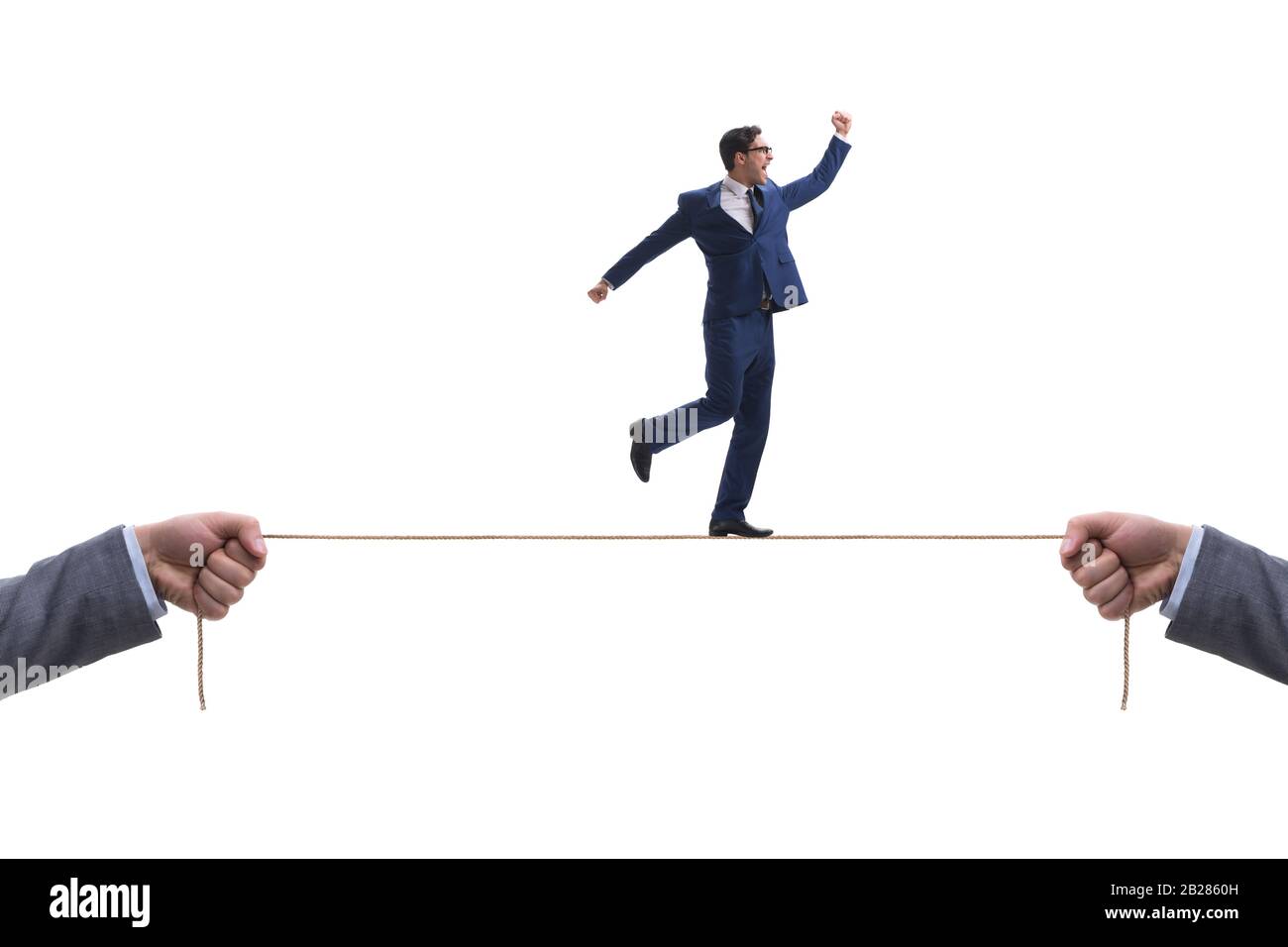 The businessman walking on tight rope Stock Photo - Alamy