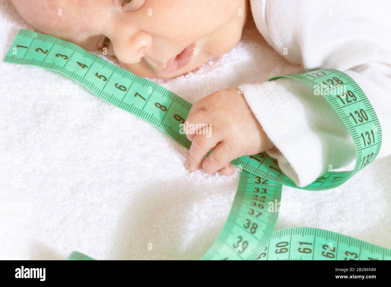 Measuring the length of the newborn hi-res stock photography and images ...
