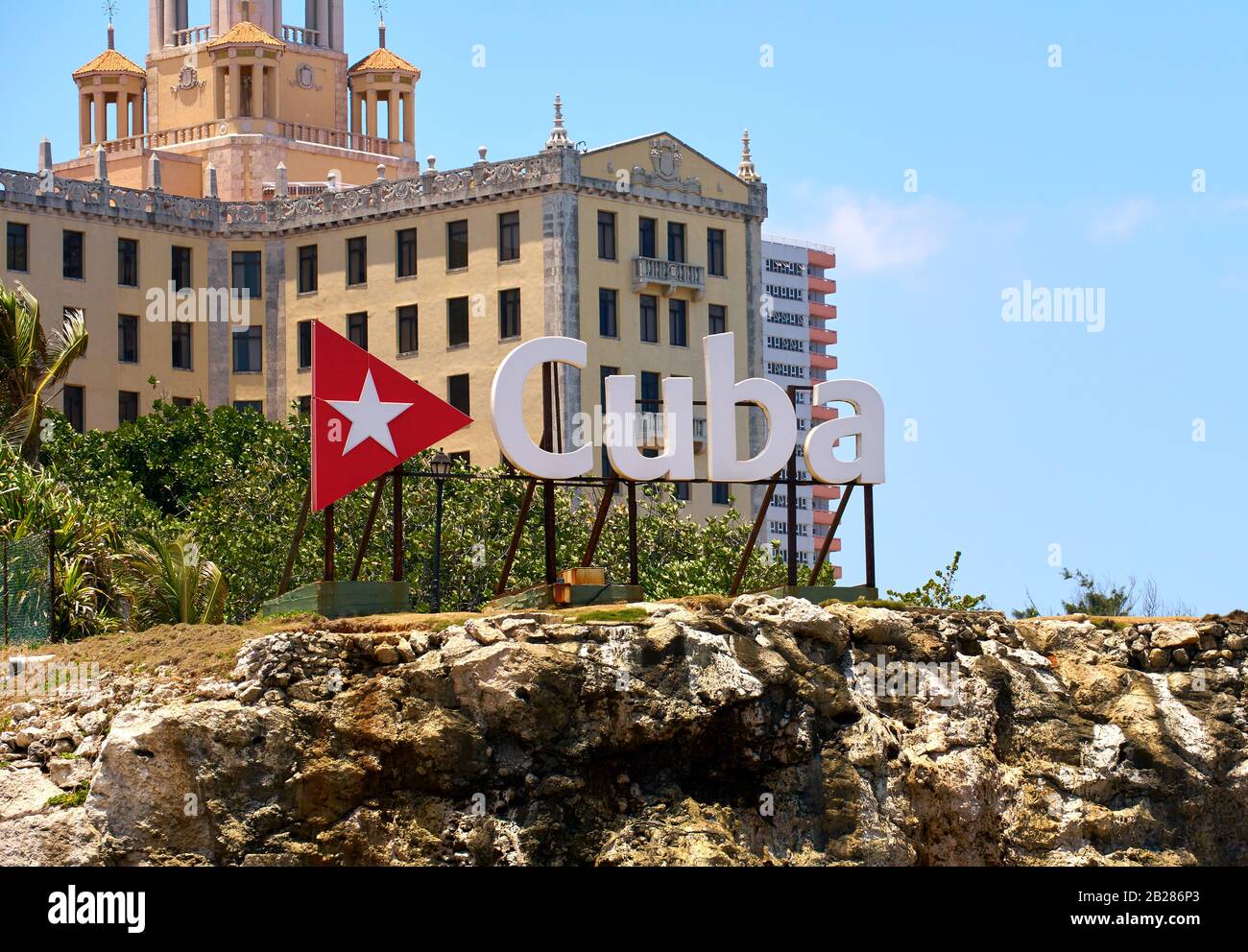 Cuba word sign with red triangle and a star over Hotel Nacional ...