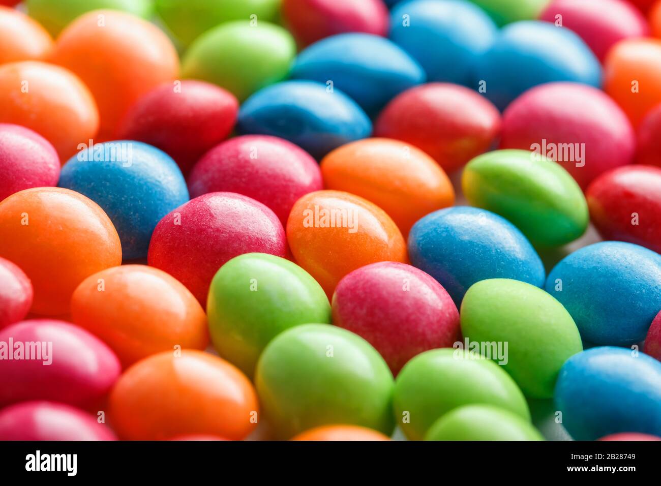 Texture-background of multicolored candies. Colors of the rainbow close ...