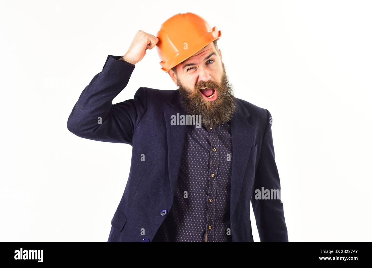 Builder or construction manager with long beard winks. Bearded man ...