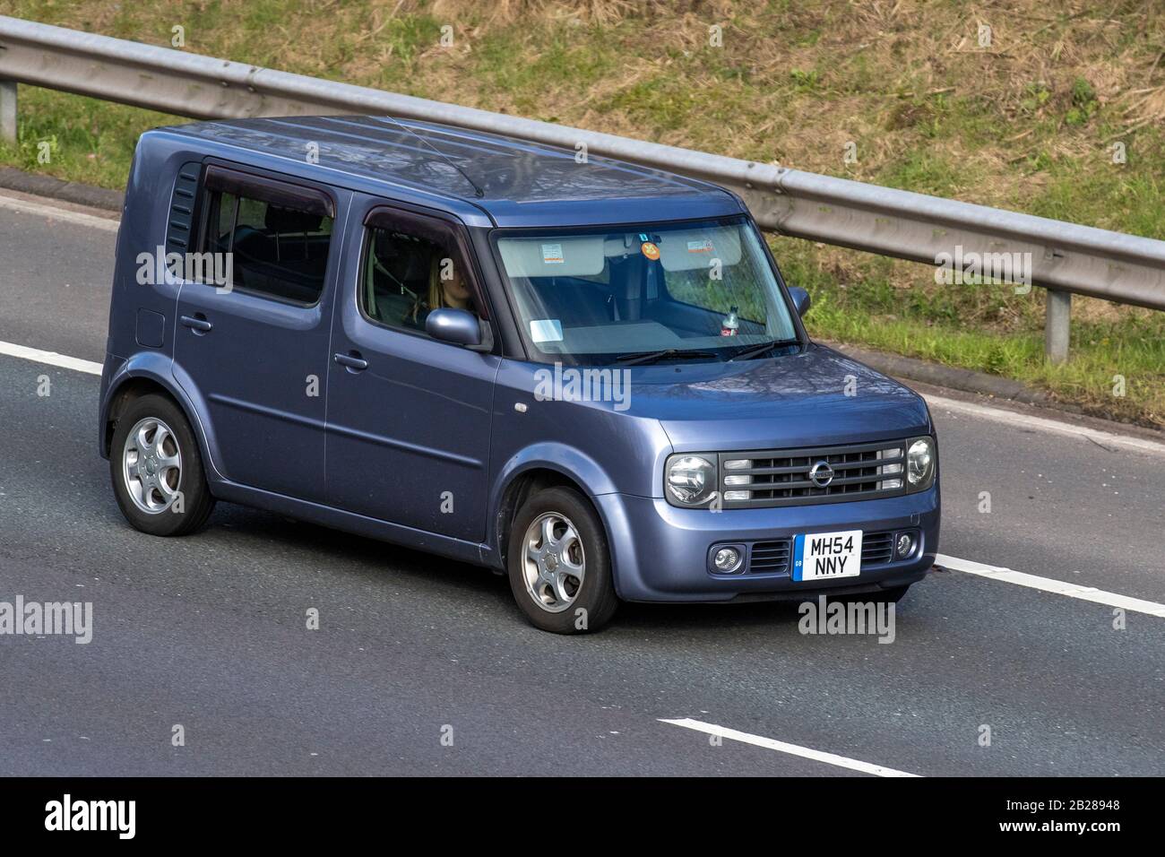2004 blue NISSAN CUBE; Vehicular traffic, transport, modern vehicles ...