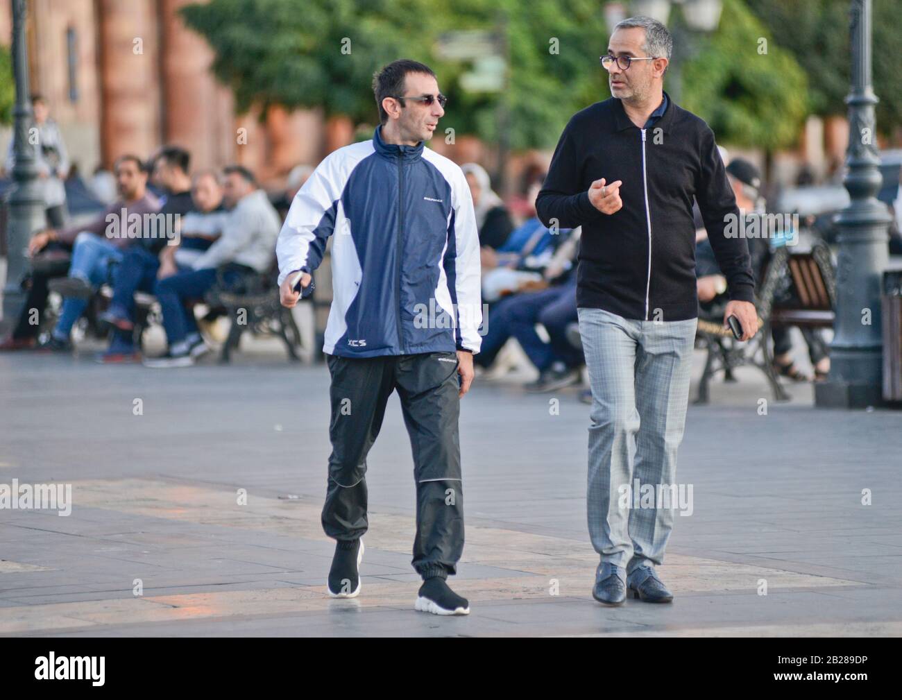 Armenian men walking in Republic Square, Yerevan, Armenia Stock Photo ...
