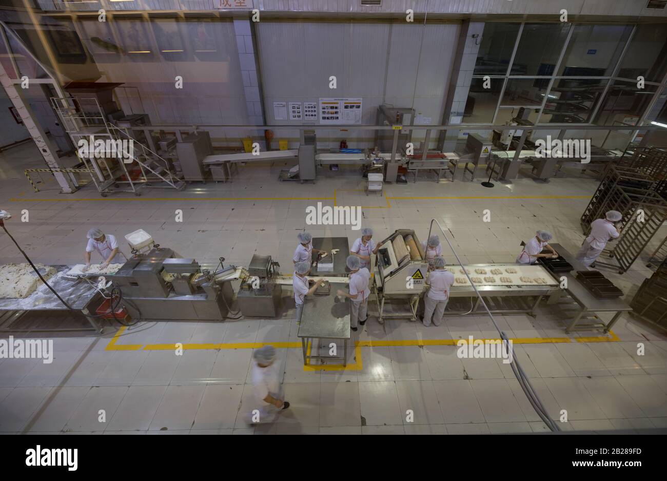 BEIJING, СHINA - JUNE 01, 2019: Industrial production of bread baking ...