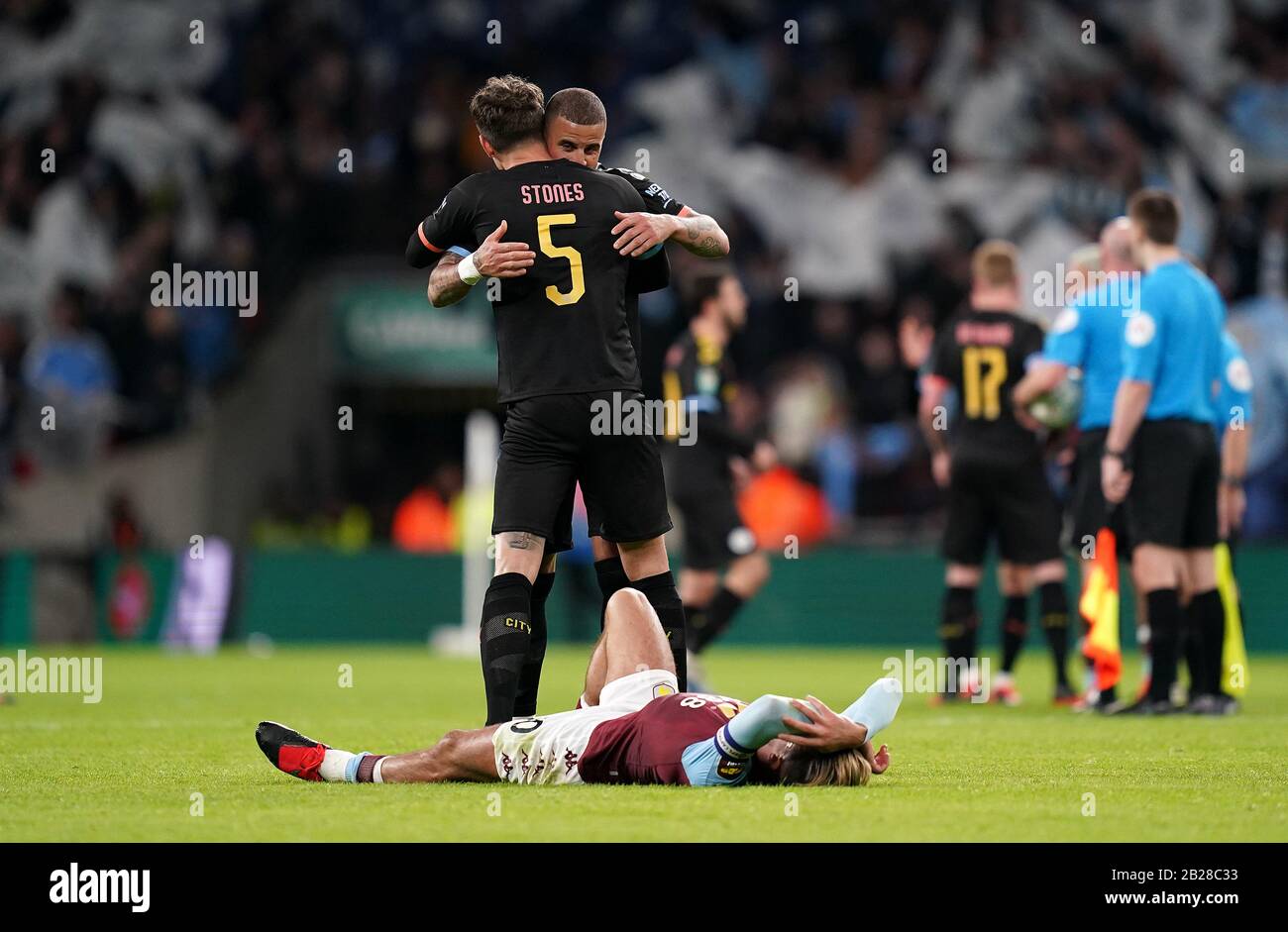 Manchester City's John Stones (left) and Kyle Walker celebrate as Aston ...