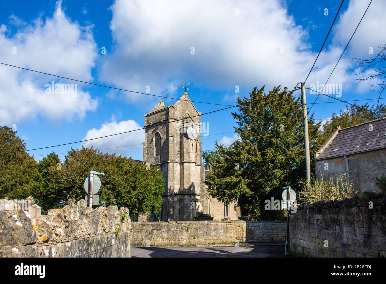 The clock tower of St Nicholas church in the village of Winsley in ...