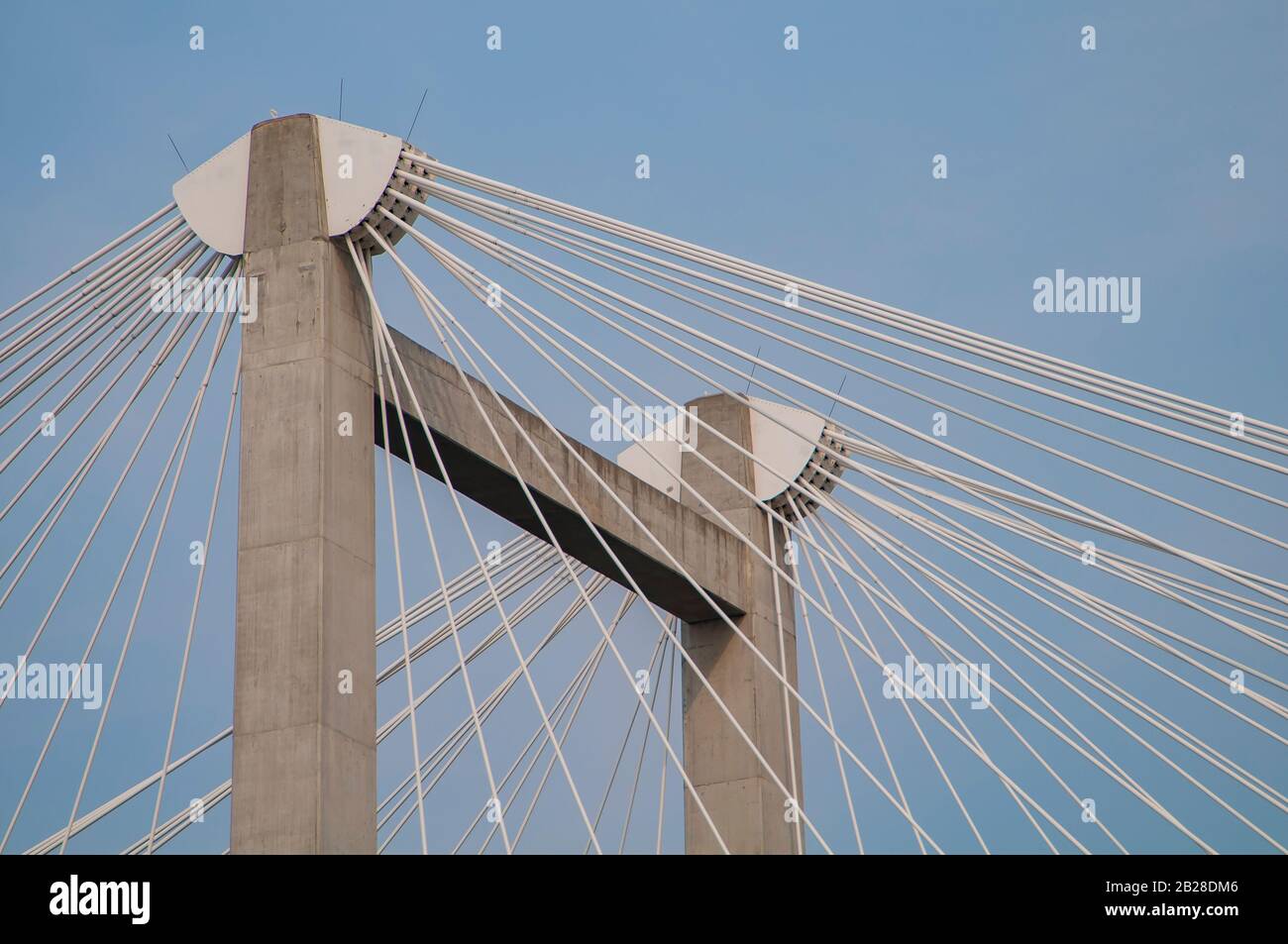 Long segmented metal suspension cables cropped to the top of the ...