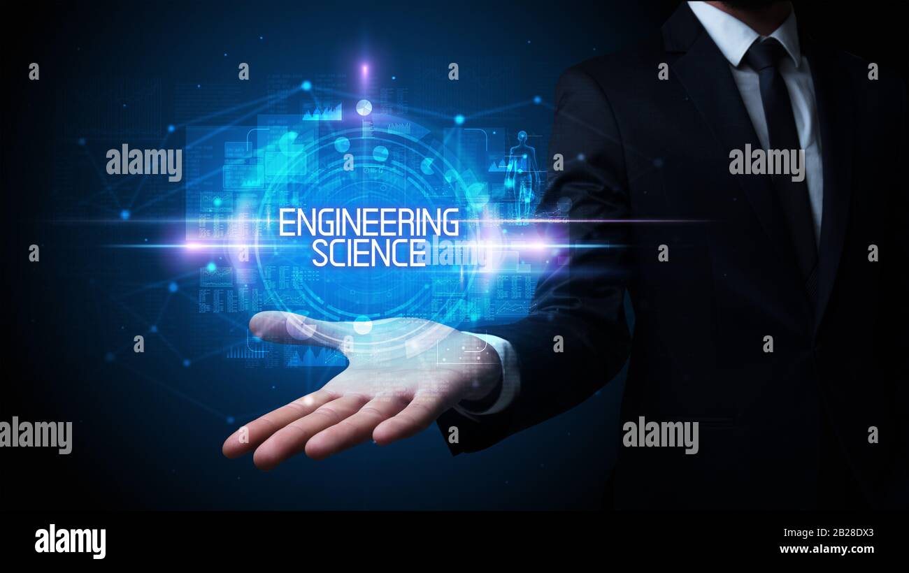 Man hand holding ENGINEERING SCIENCE inscription, technology concept ...