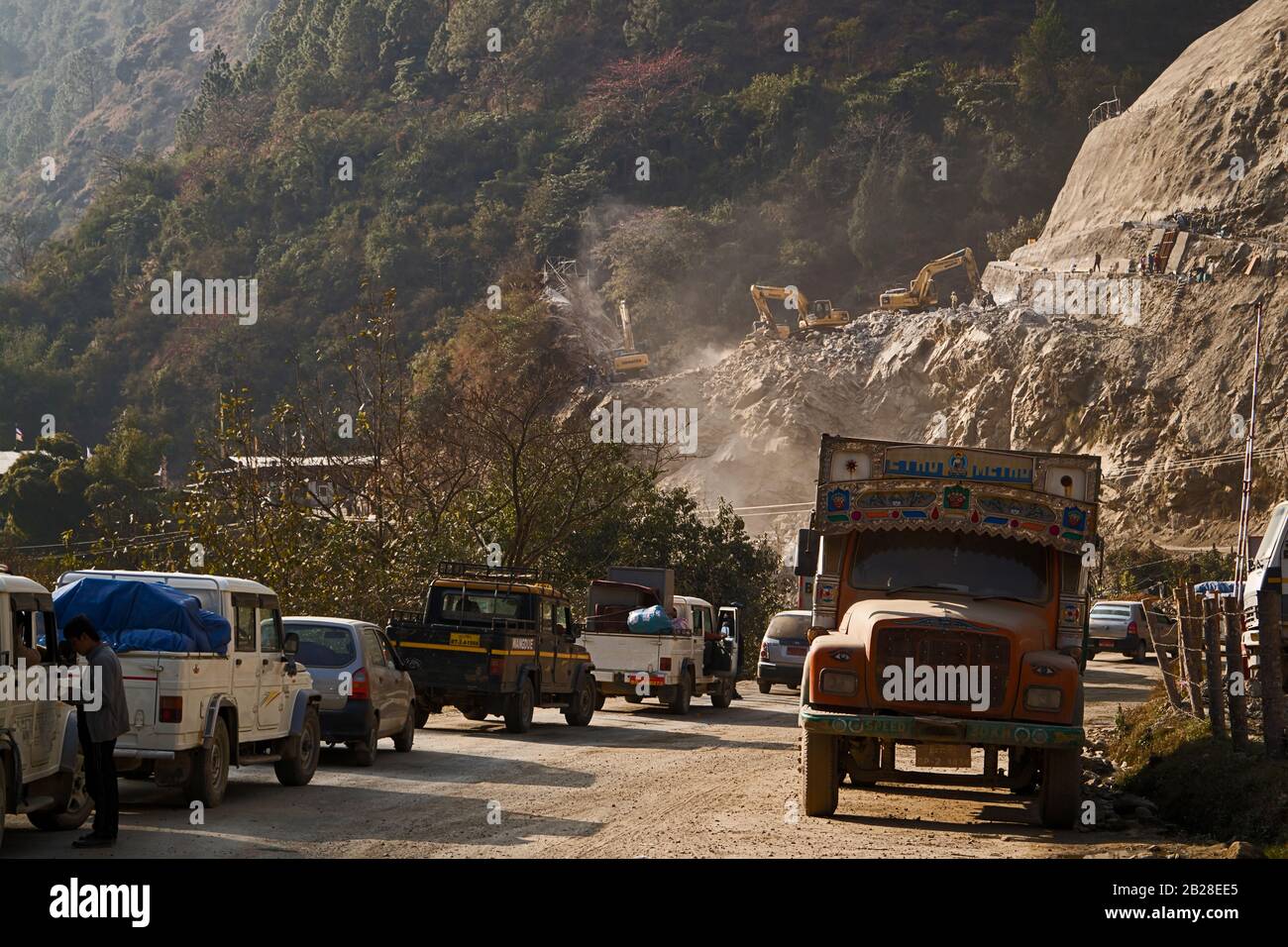 Road construction and traffic jam in Himalayan foothills, Bhutan Stock ...