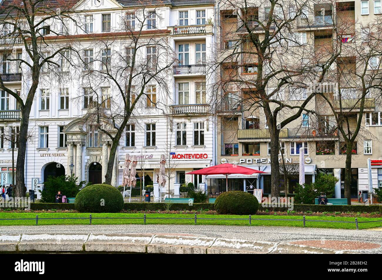 Berlin, Germany - February 27, 2020: View to houses with various shops ...