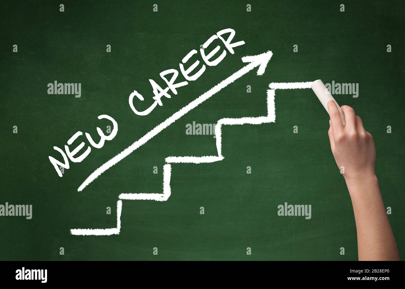 Hand drawing NEW CAREER inscription with white chalk on blackboard ...