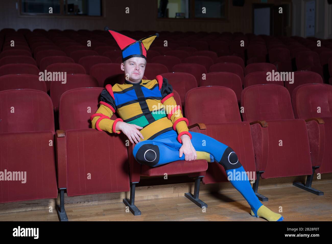 Actor dressed jester's costume in interior of old theater Stock Photo ...
