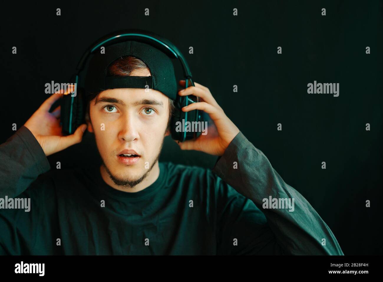 Cyber sport. Young handsome game streamer finally wins a round in a ...