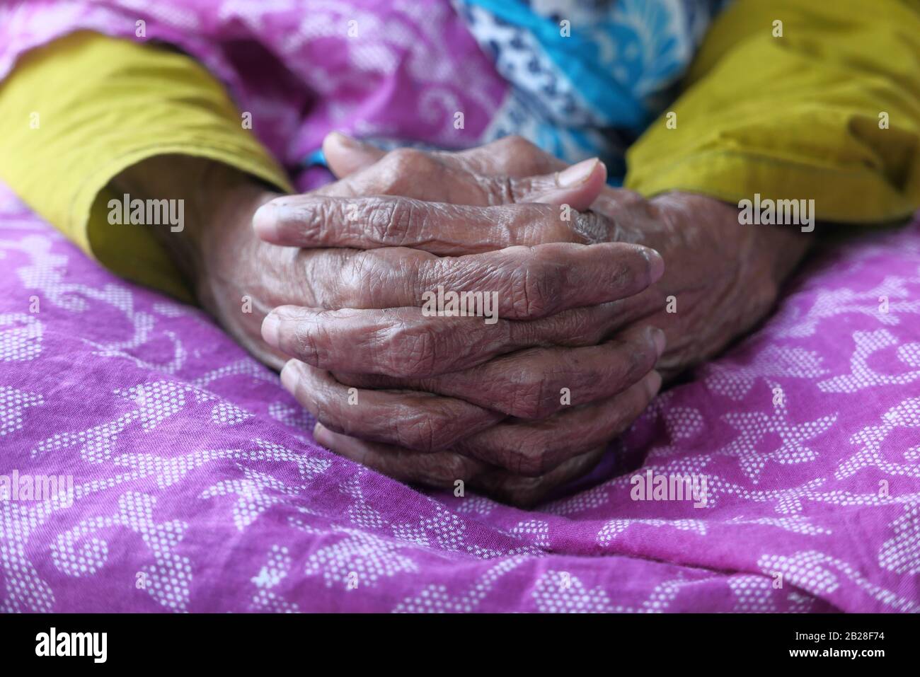 Folded hands dying person hi-res stock photography and images - Alamy