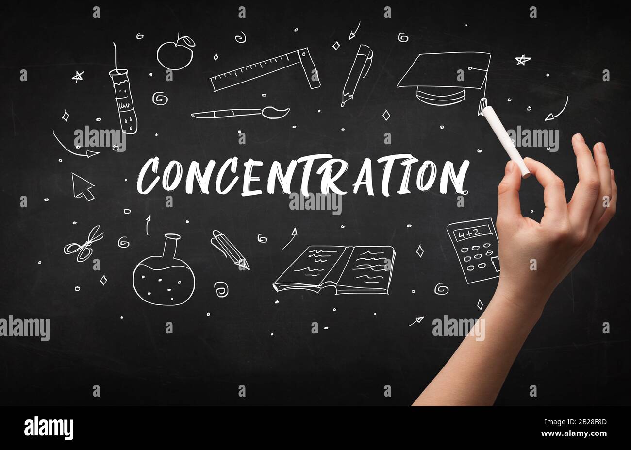Hand drawing CONCENTRATION inscription with white chalk on blackboard ...
