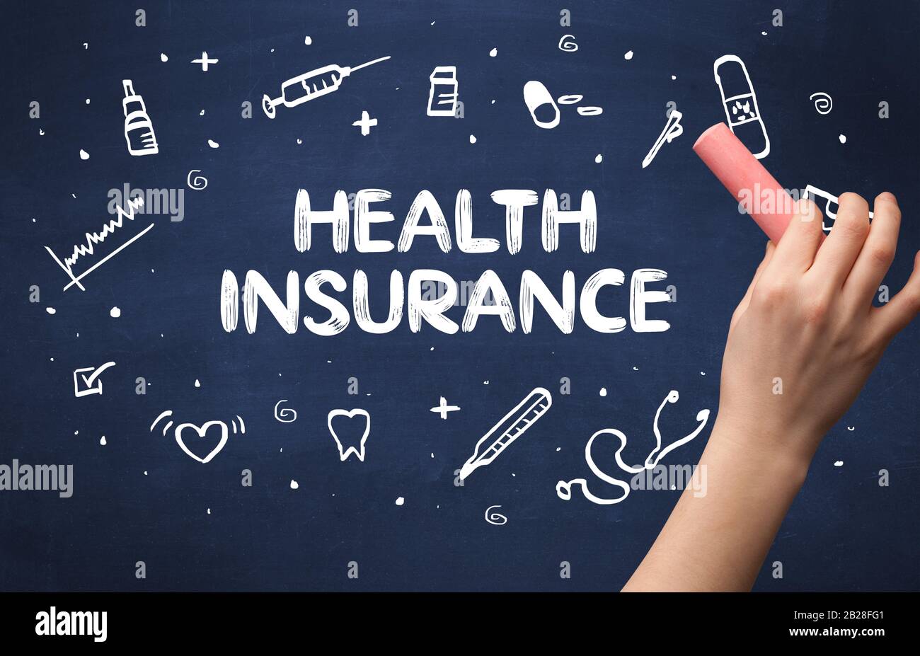 Hand drawing HEALTH INSURANCE inscription with white chalk on ...