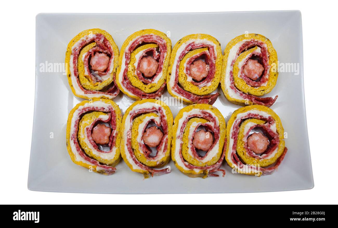 delicious appetizer rolls on a plate. home made food isolated on white ...