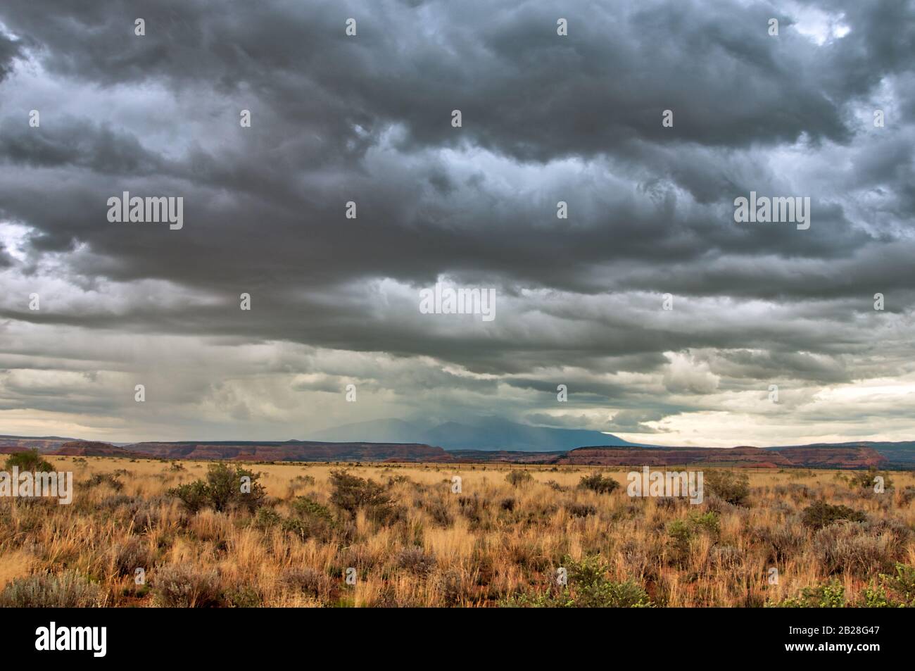 Dynamic and Cloudy Sky above the dry of the high desert with rain ...