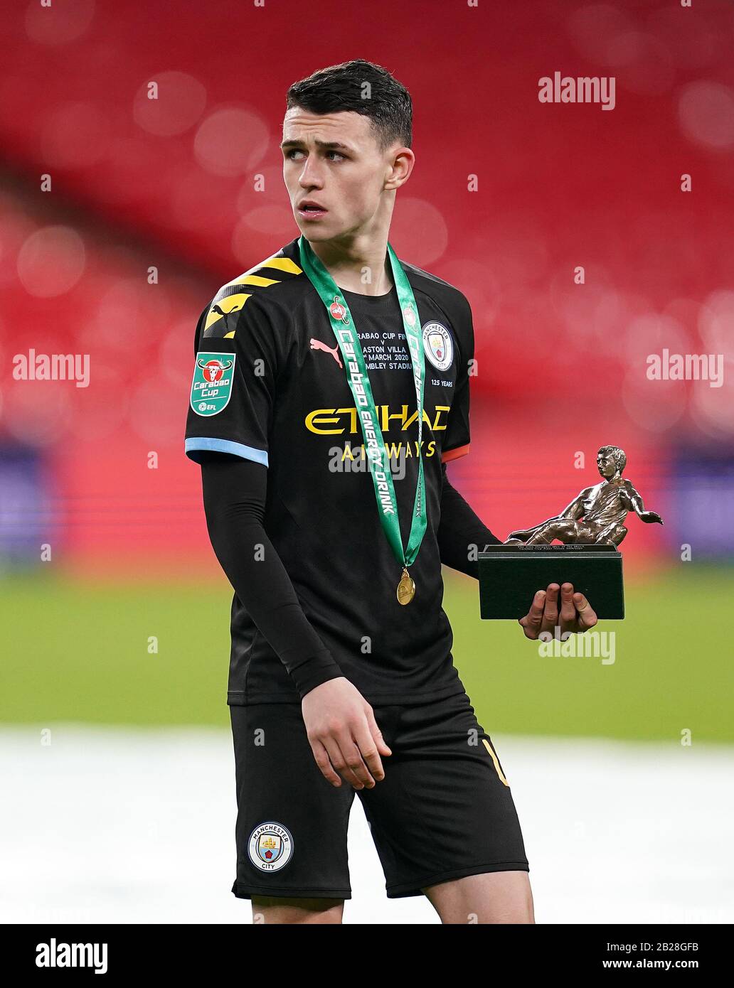 Manchester City's Phil Foden with his Man of the Match trophy after the ...