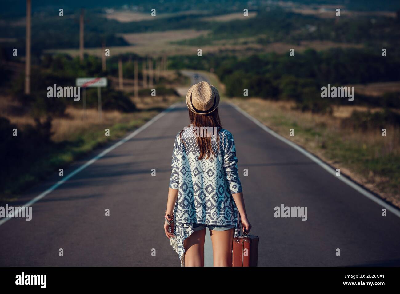 Young beautiful Asian woman in hippy style. travels by hitchhiking ...
