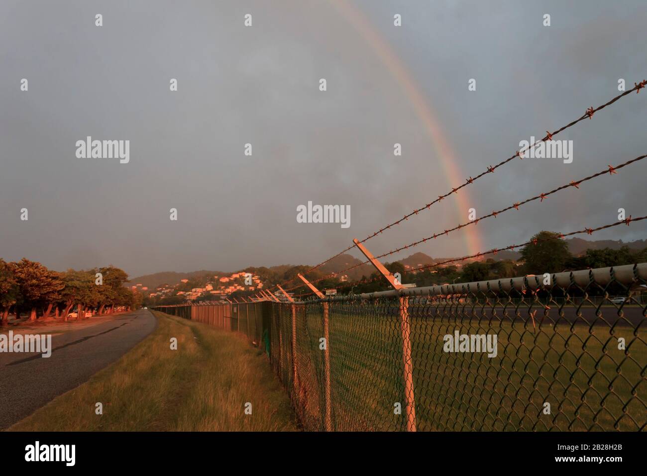 Sunset and rainbow a beautiful combination, casting a copper, reddish ...