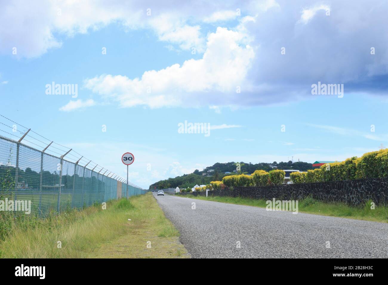 Stretch of highway running parallel to the Vigie Airport on a hot sunny ...