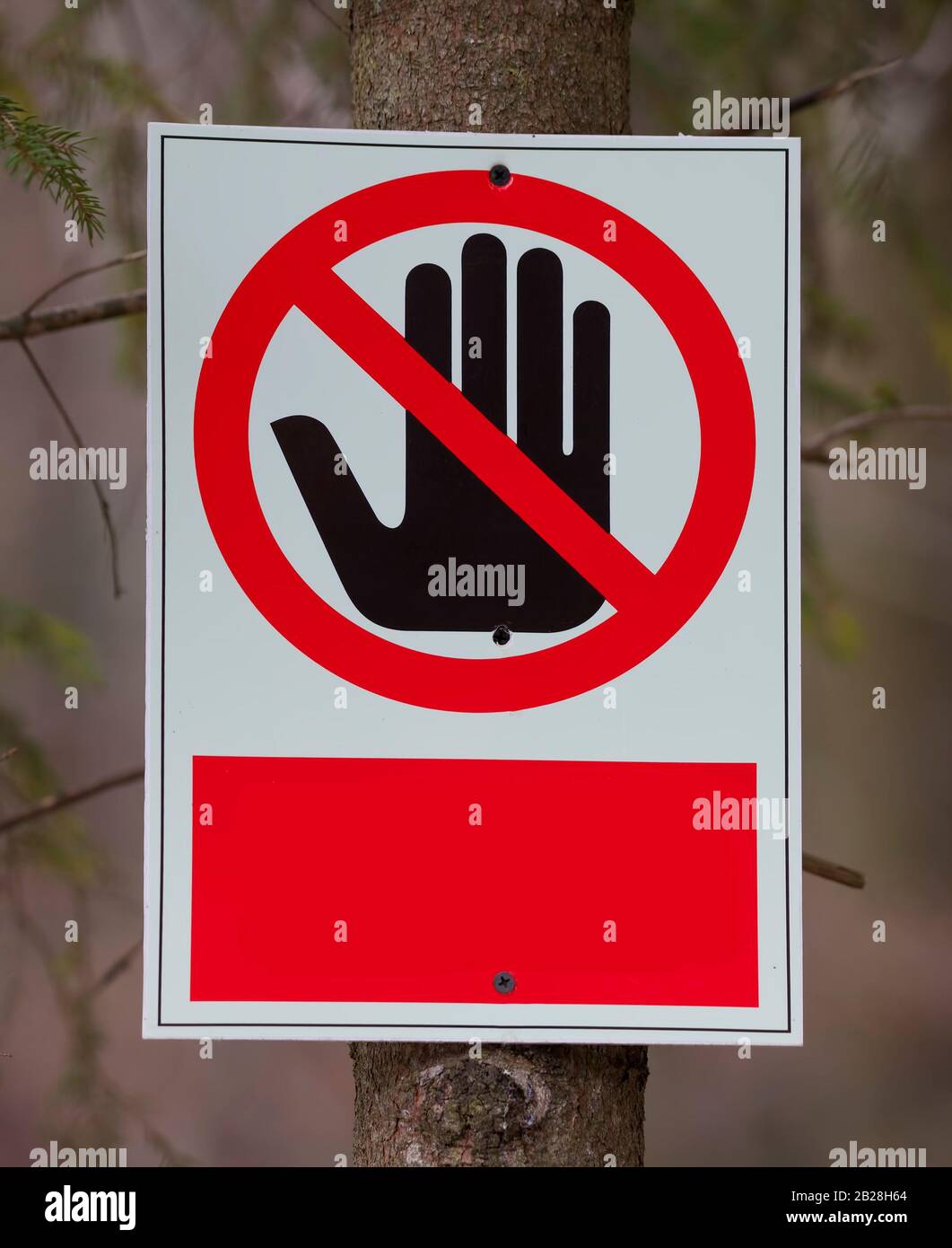 no trespassing sign on a tree. access forbidden Stock Photo - Alamy