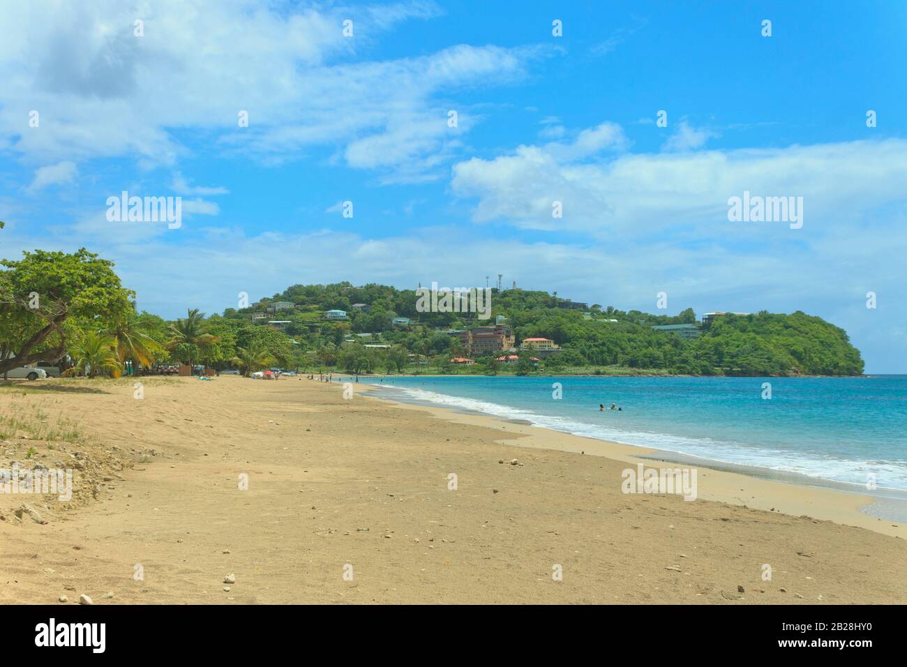 Enchanting view of the blue sea, sandy shore and green landscape ...