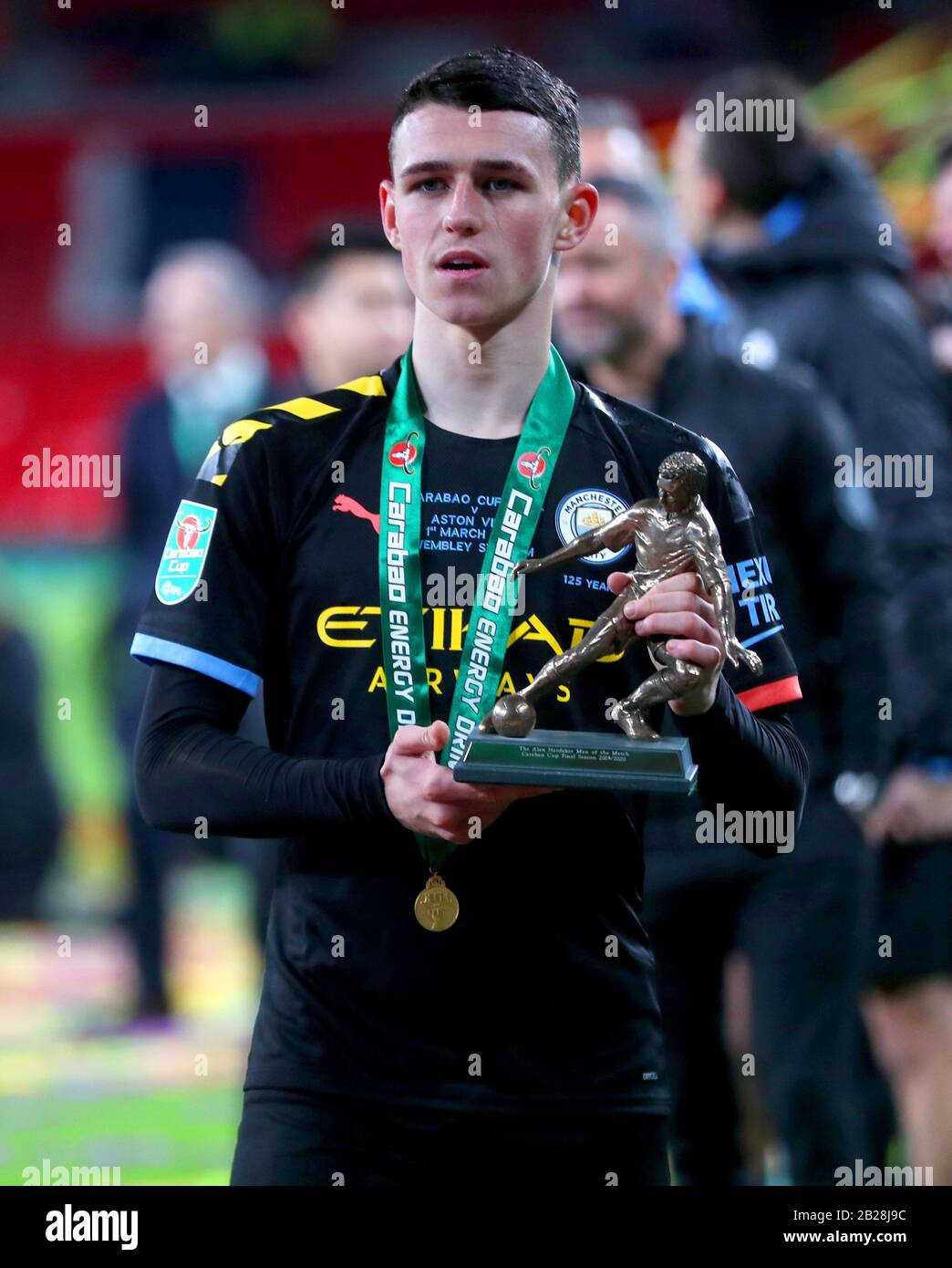 Manchester City's Phil Foden with his man of the match trophy as he ...