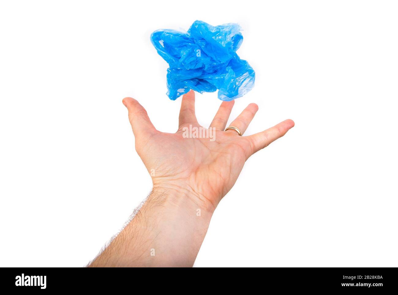 hand holding blue plastic bag isolated on white background. recycle or ...
