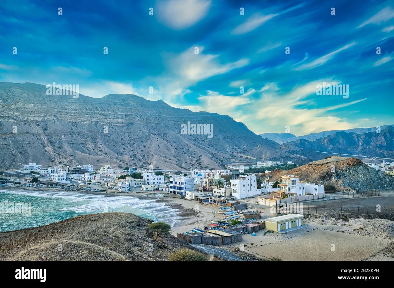 Aerial view of a small fishing village in the valley. From Muscat, Oman ...