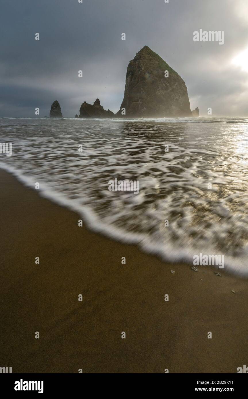 Haystack rock rising from pacific hi-res stock photography and images ...