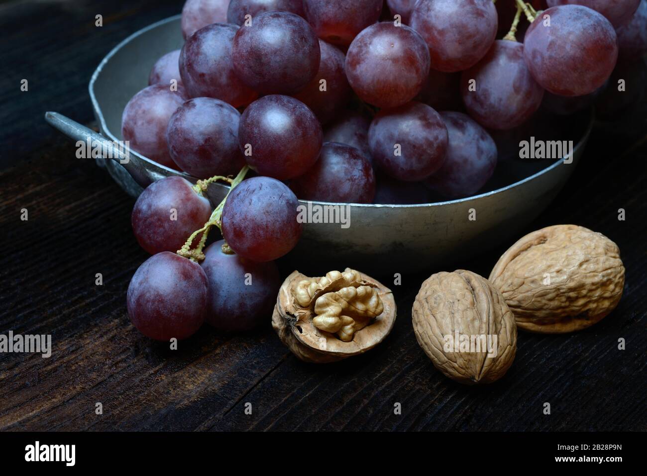 Red grapes in shell and walnuts hi-res stock photography and images - Alamy