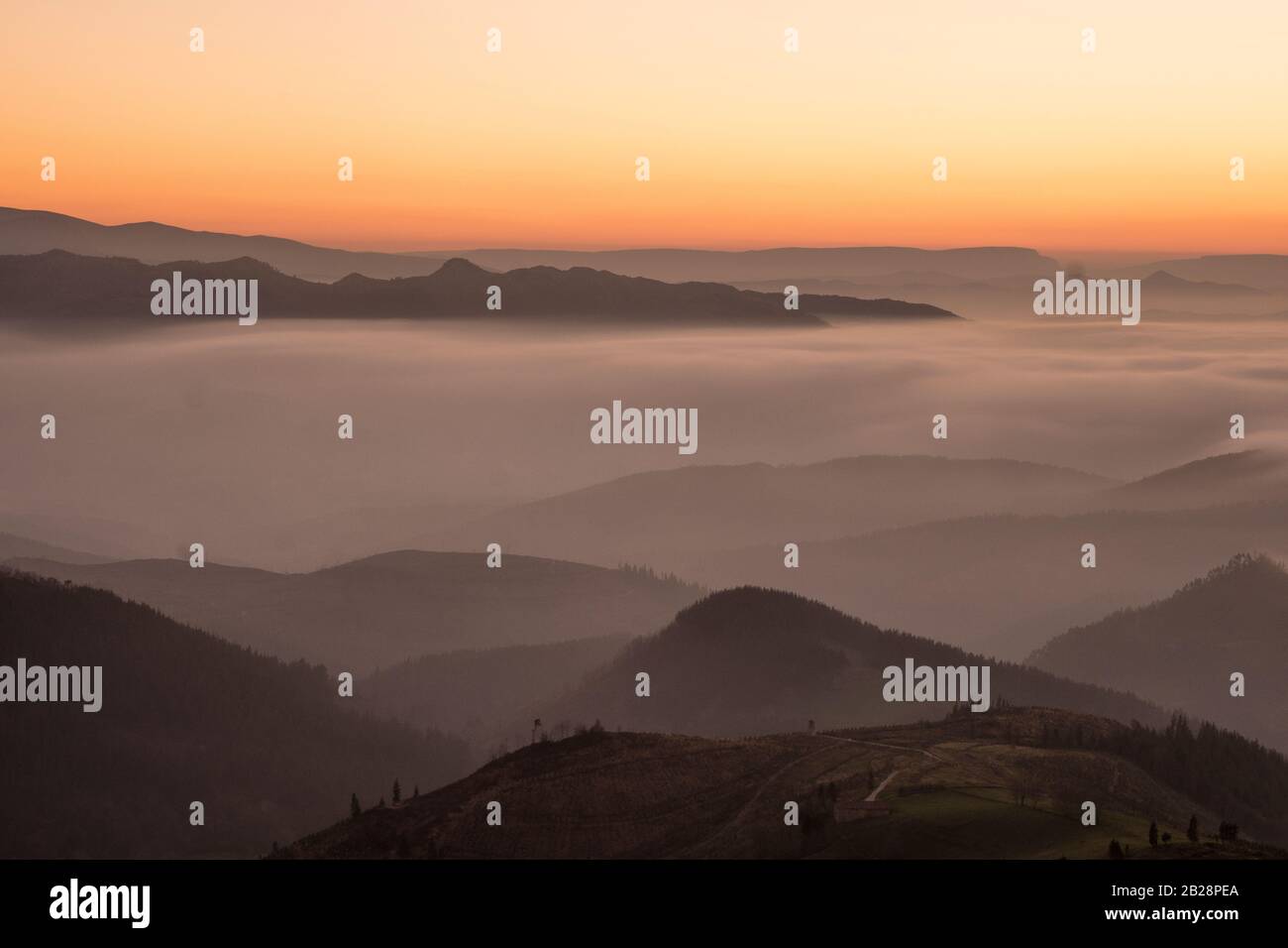 misty mountains in basque country (spain Stock Photo - Alamy