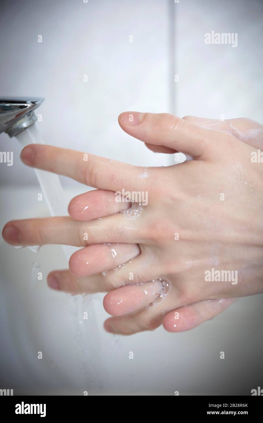 Close-up of someone washing their hands Stock Photo - Alamy
