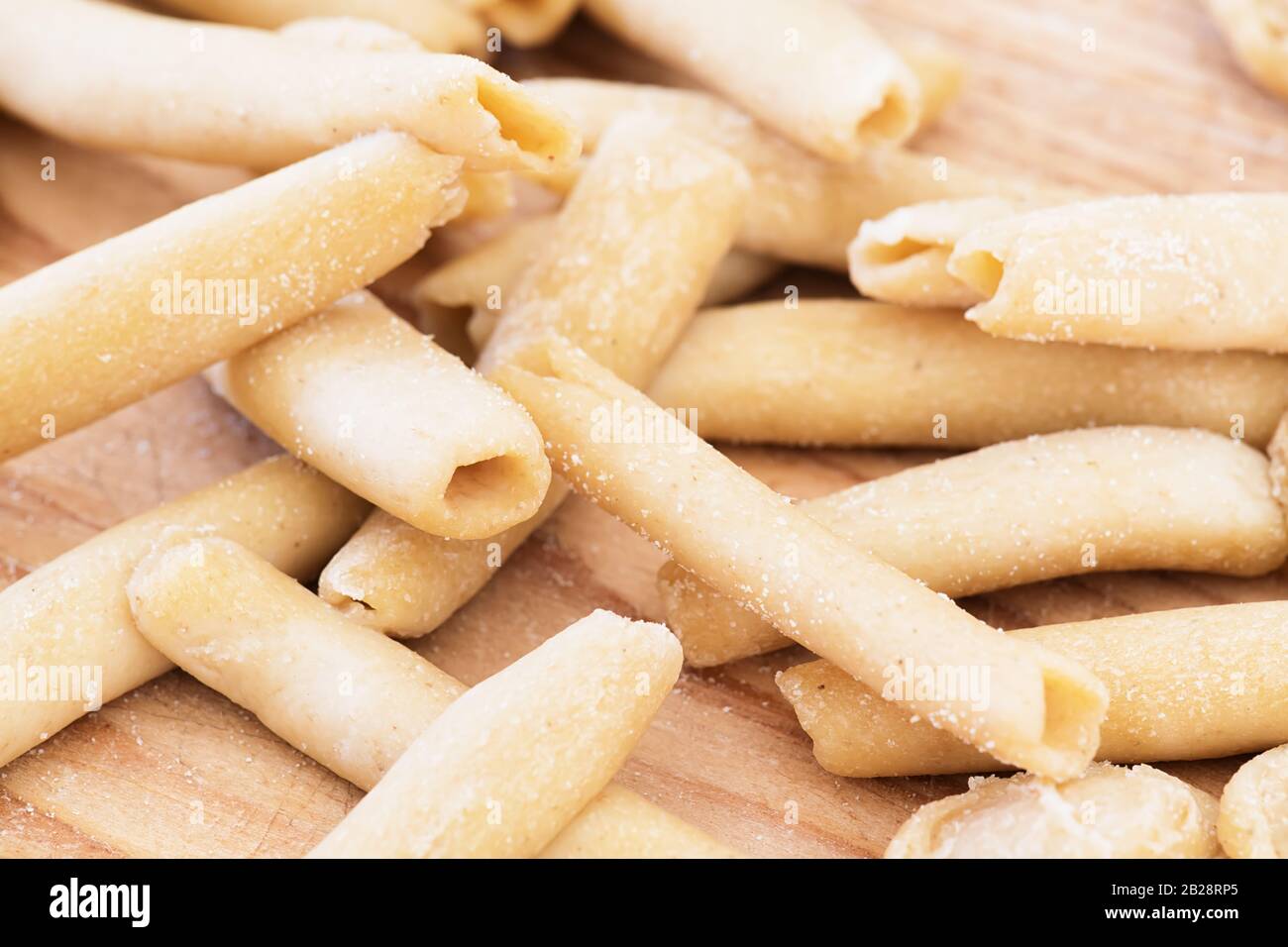 Homemade raw apulian pasta Maccheroncini typical dish of Southern Italy ...