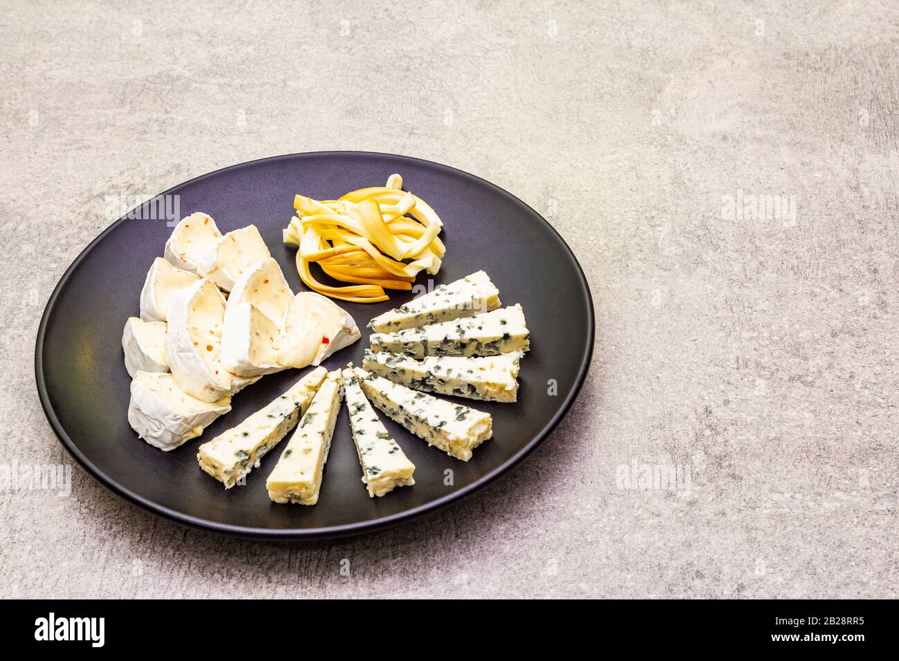 Delicious snack assorted cheeses plate. Bavarian cheese with jalapeno ...