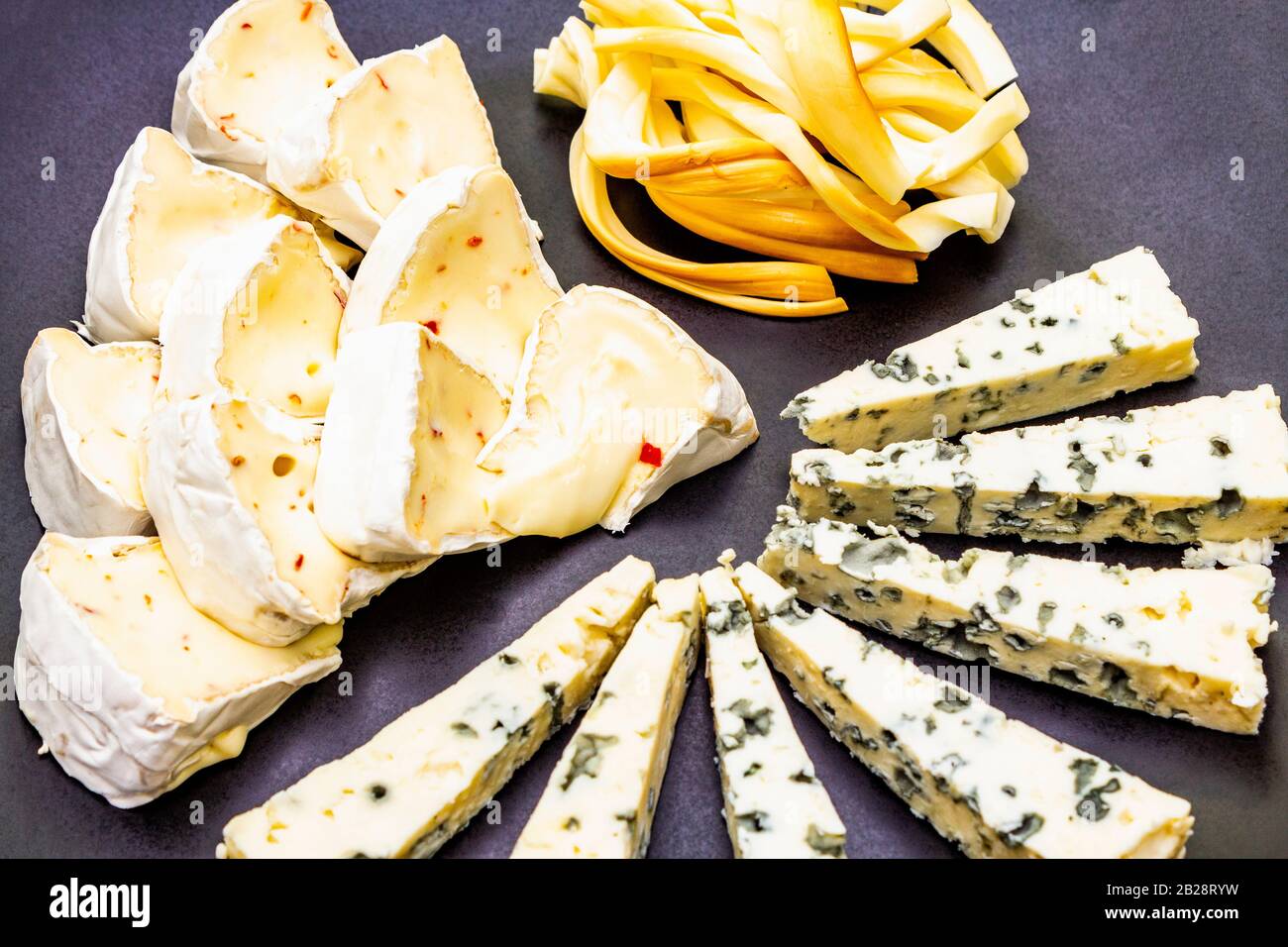Delicious snack assorted cheeses plate. Bavarian cheese with jalapeno ...