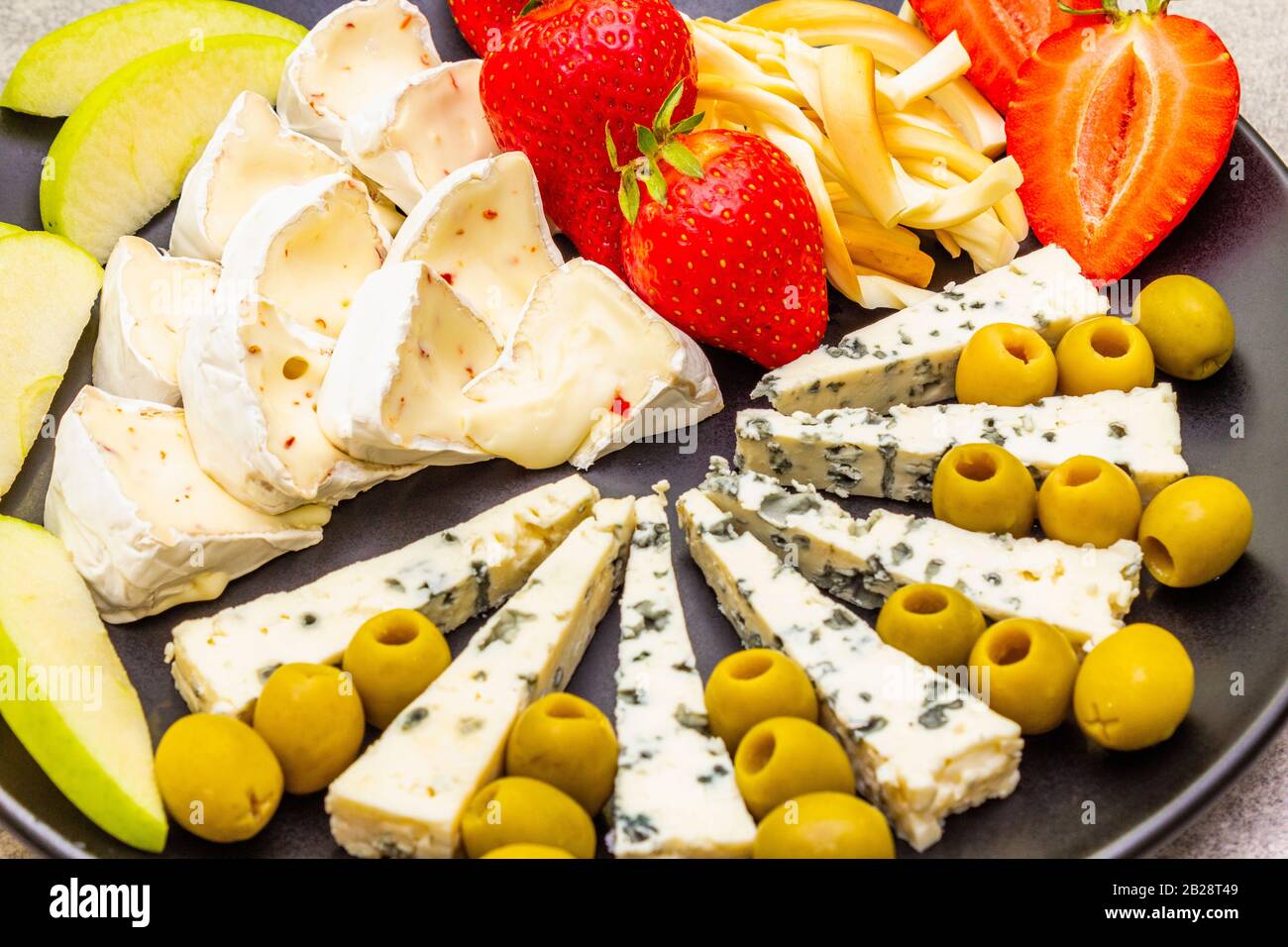 Delicious snack assorted cheeses plate. Bavarian cheese with jalapeno ...