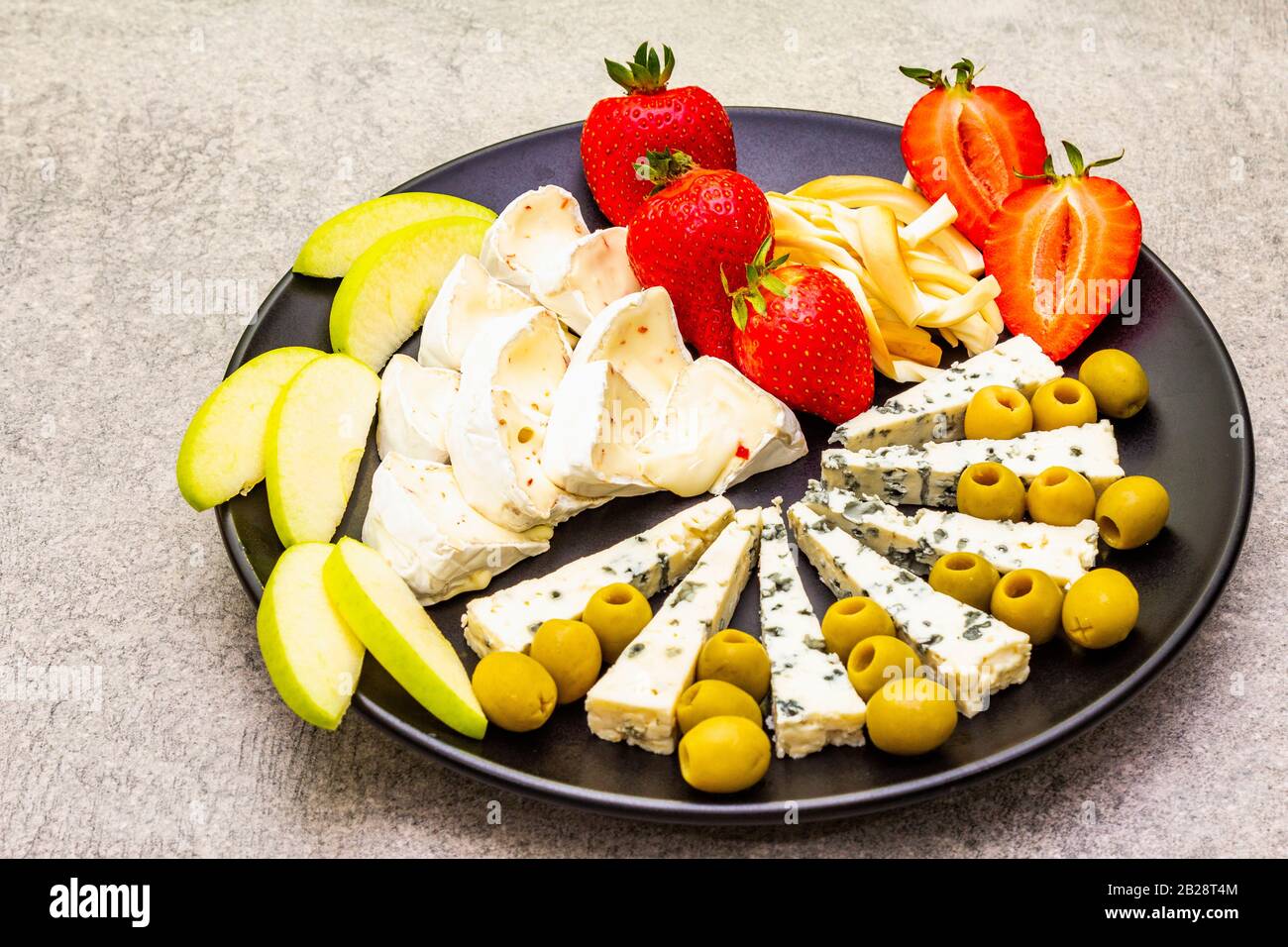 Delicious snack assorted cheeses plate. Bavarian cheese with jalapeno ...