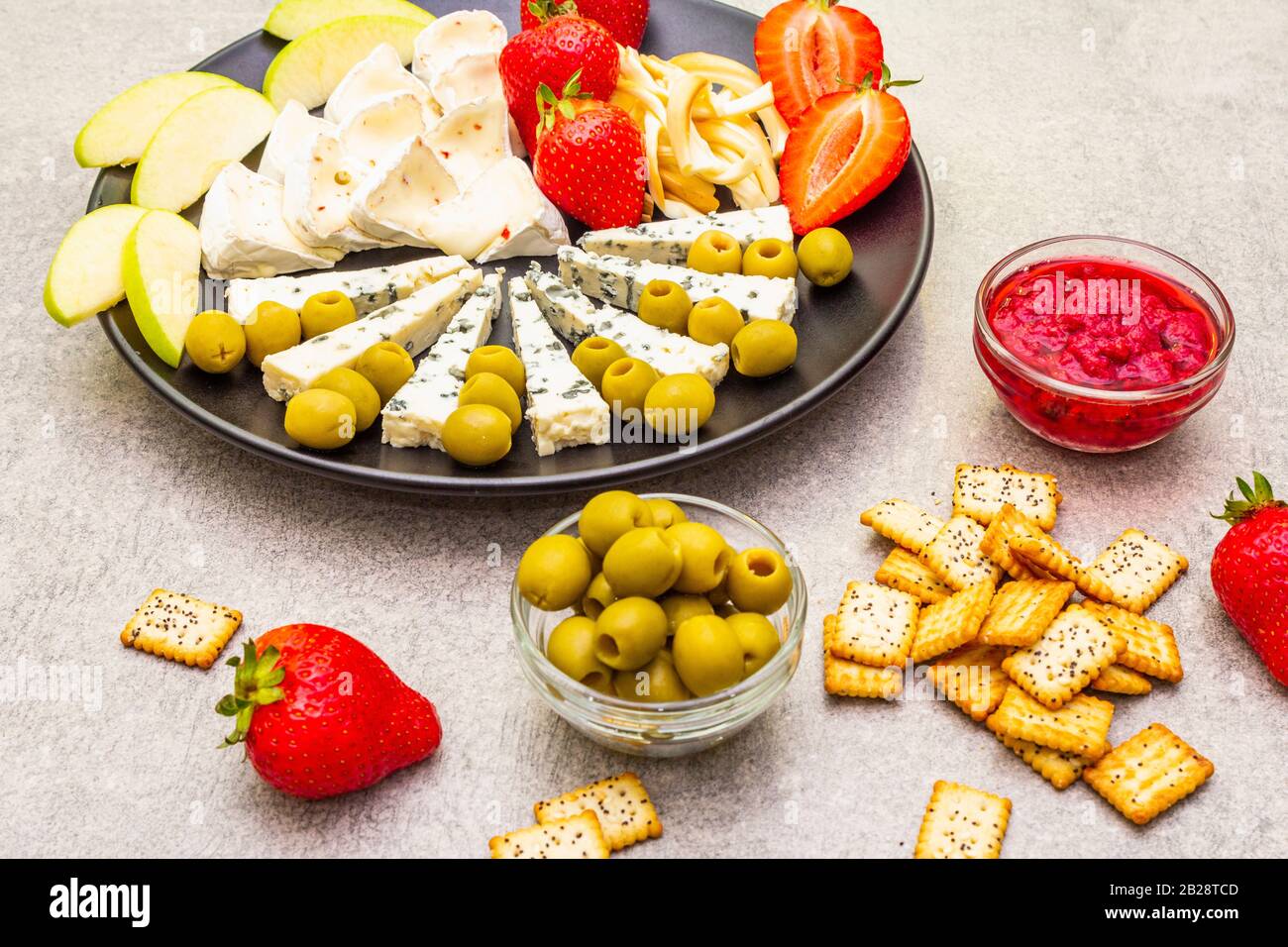 Delicious snack assorted cheeses plate. Bavarian cheese with jalapeno ...