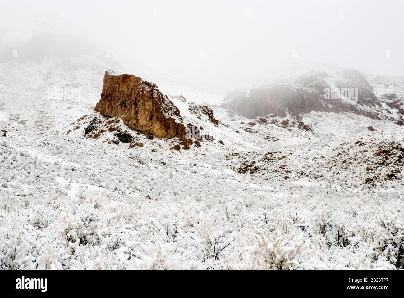 Brown, Rocky, and Jagged Mountain Cliffs Erupting from the White ...