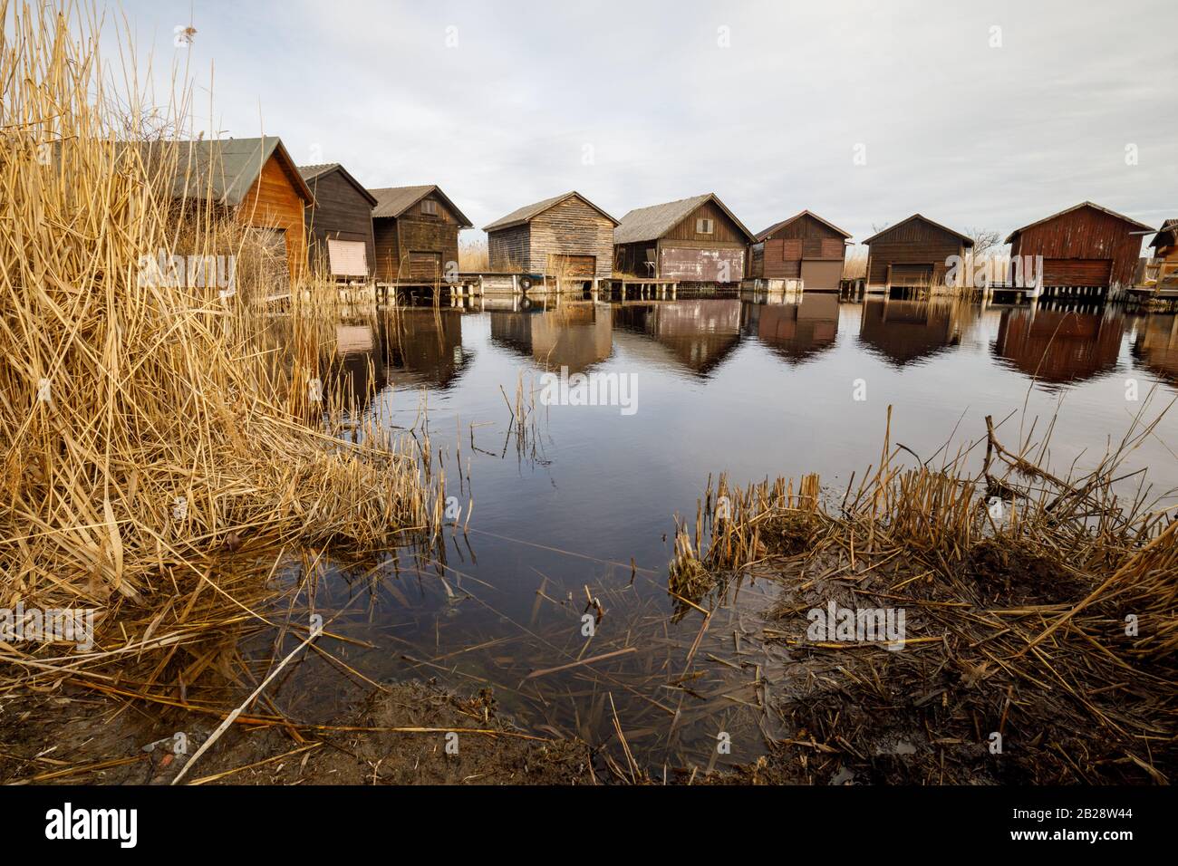 Neusiedler See, Lake Neusiedl. Bay with wooden pier and wooden cottage ...