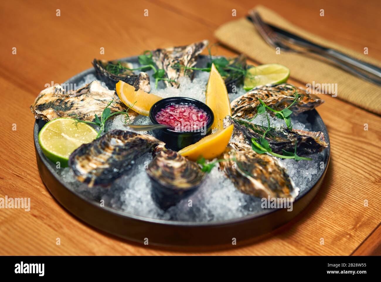 man eating oysters at the table Stock Photo - Alamy