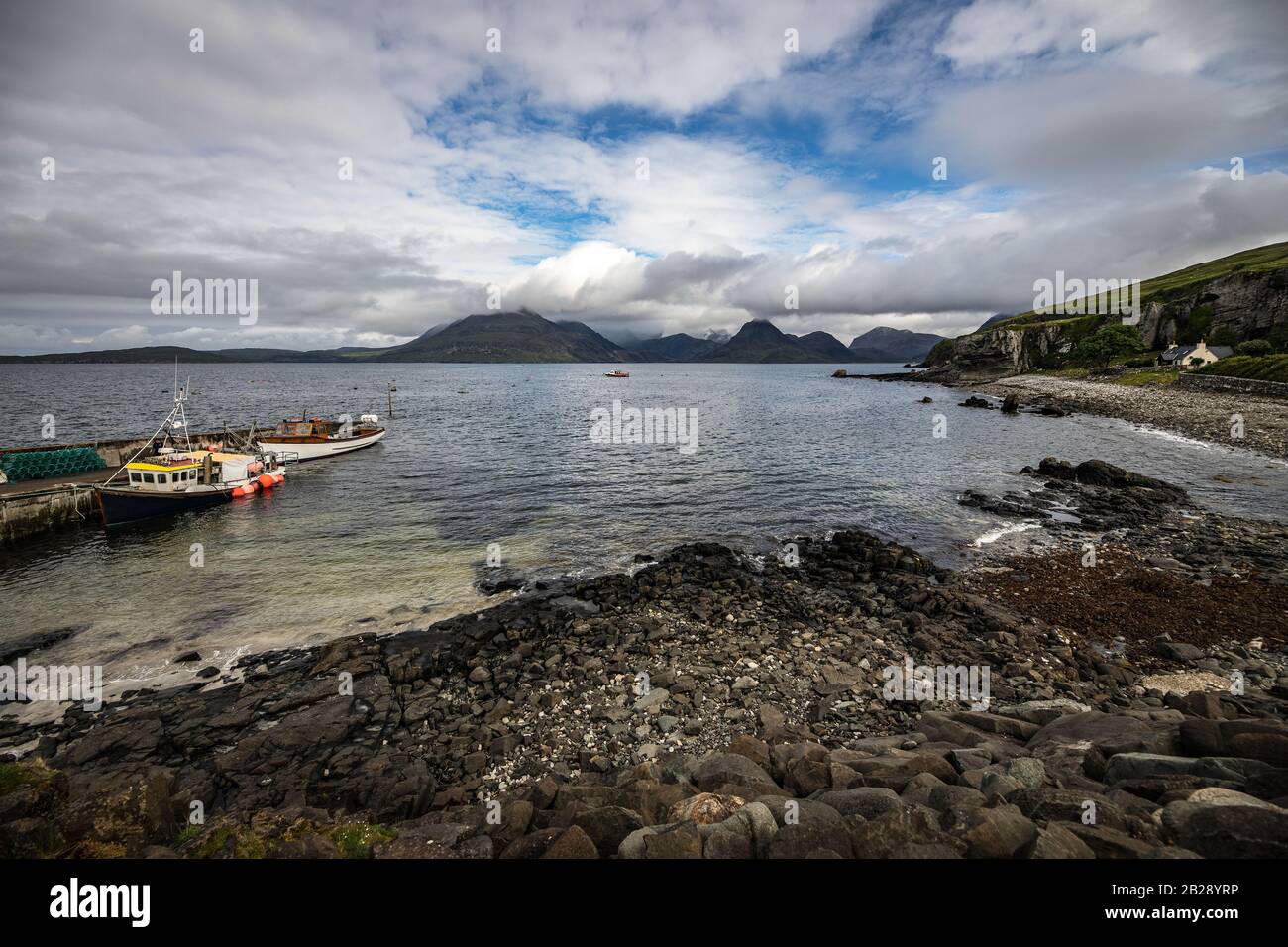 Beautiful scenic landscape of amazing Scotland nature with fishing boat ...