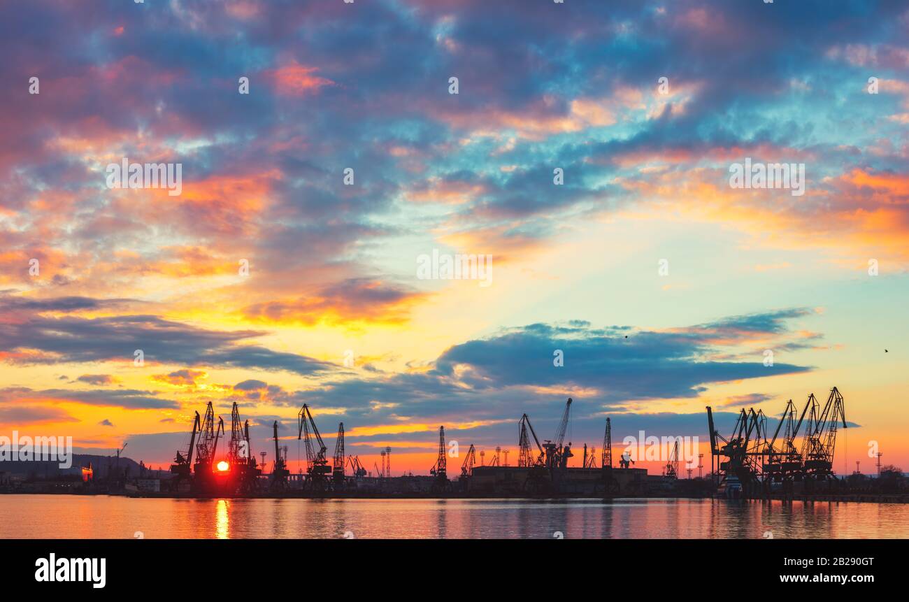 Sea port and industrial cranes, Varna, Bulgaria.Sunset over the Varna ...