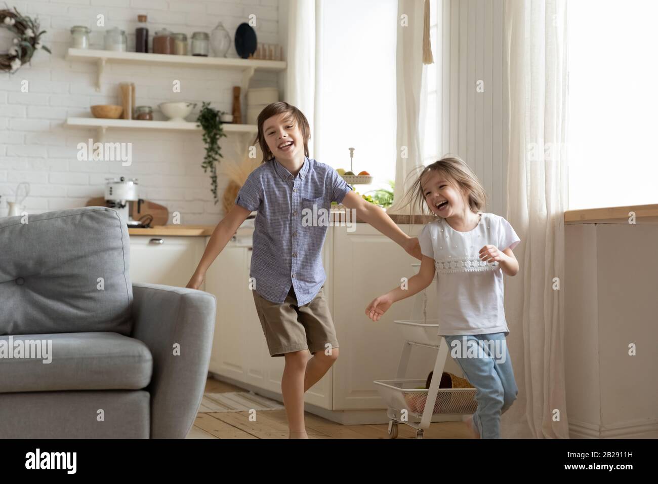 Racing siblings hi-res stock photography and images - Alamy