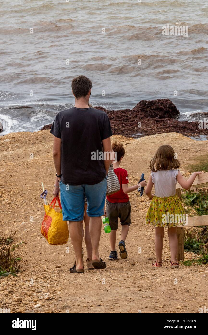 Man approaching two children hi-res stock photography and images - Alamy
